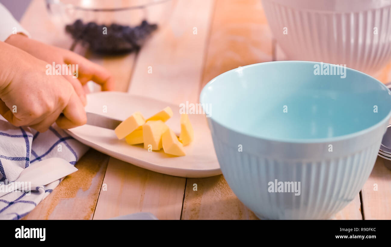 Mixing ingredients together in mixing bowl for blueberry muffins Stock ...