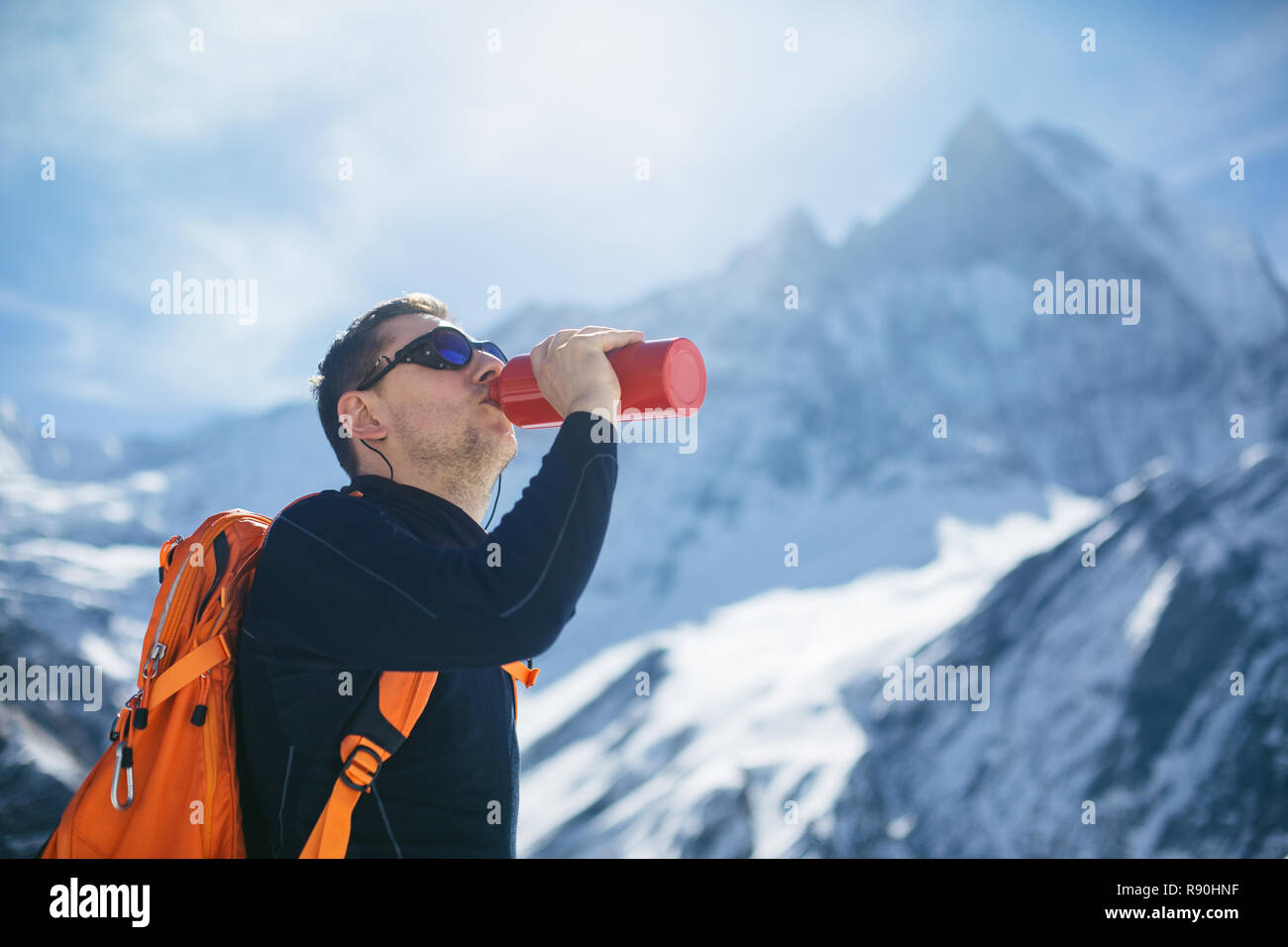 Hiker hydration. Hiker drinking water from water bottle Stock Photo - Alamy