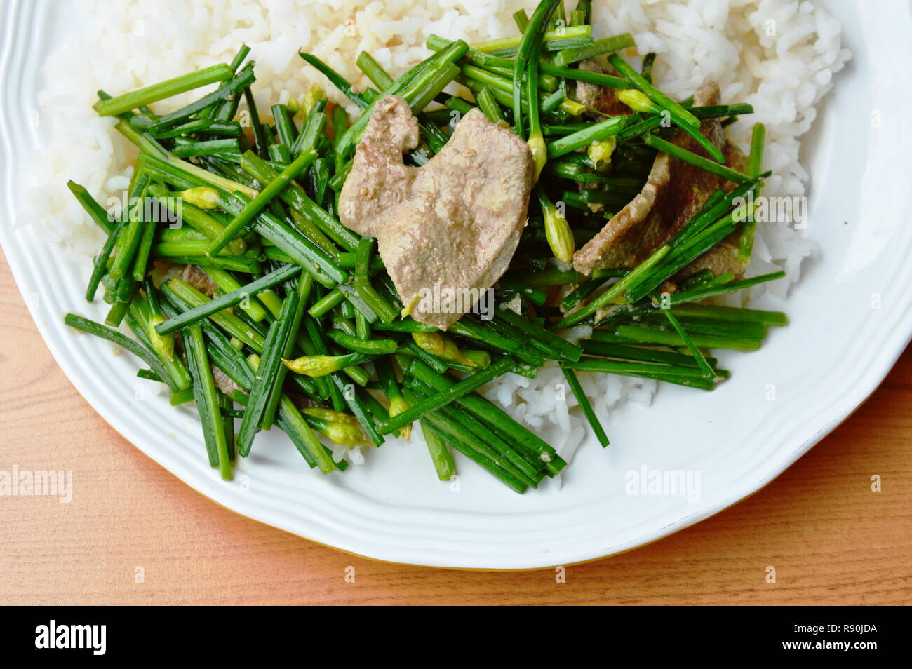 stir fried garlic chives with pork liver on rice Stock Photo - Alamy