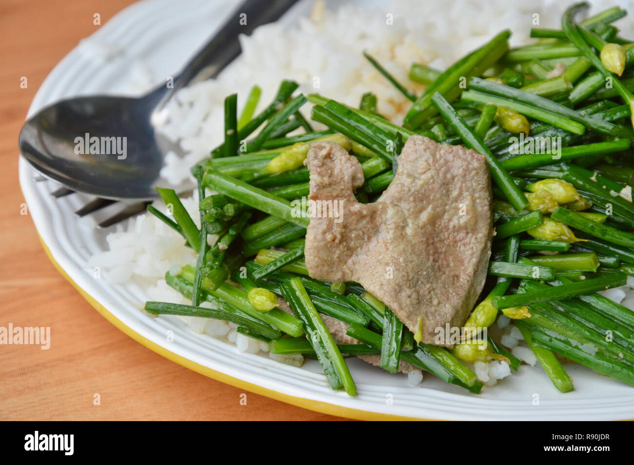stir fried garlic chives with pork liver on rice Stock Photo - Alamy
