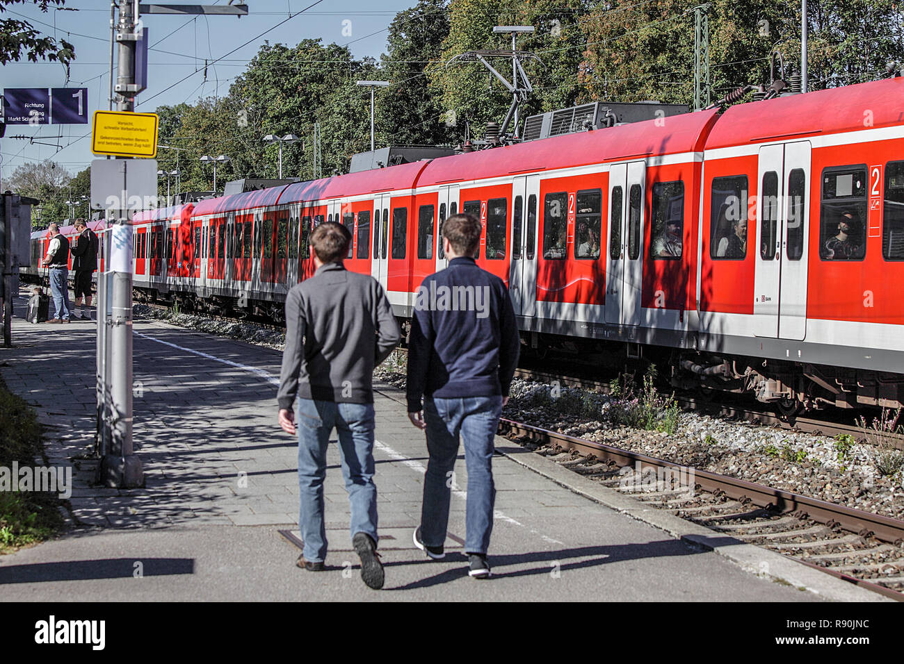 S-Bahn train at Reims Station near Munich slowly pulls away from the ...