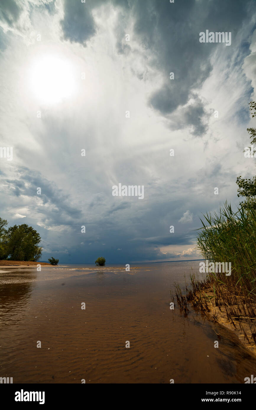 Thunder storm or storm clouds with rain over forest with river Stock ...
