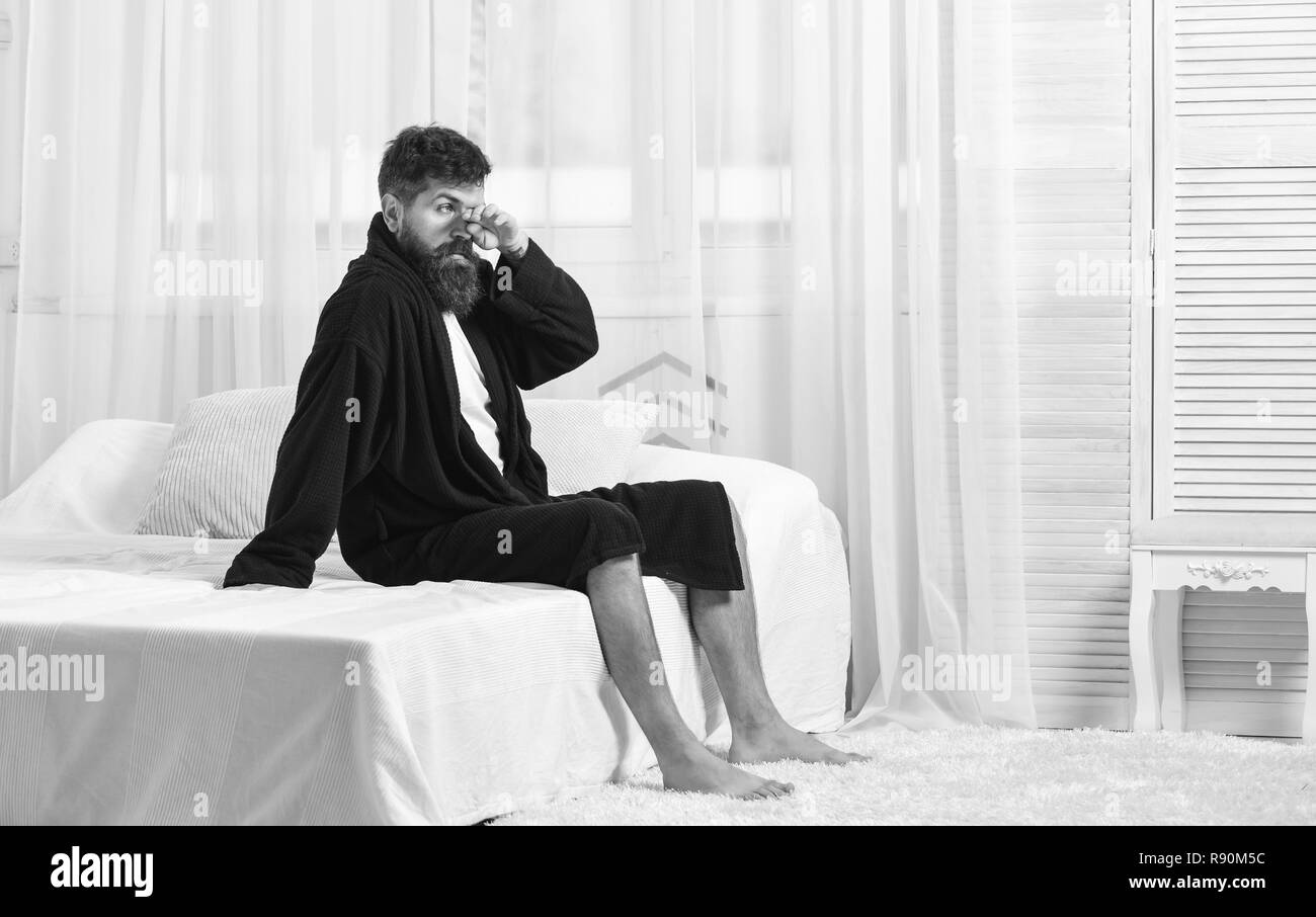 Guy on sleepy face getting up in morning. Macho with beard and mustache ...