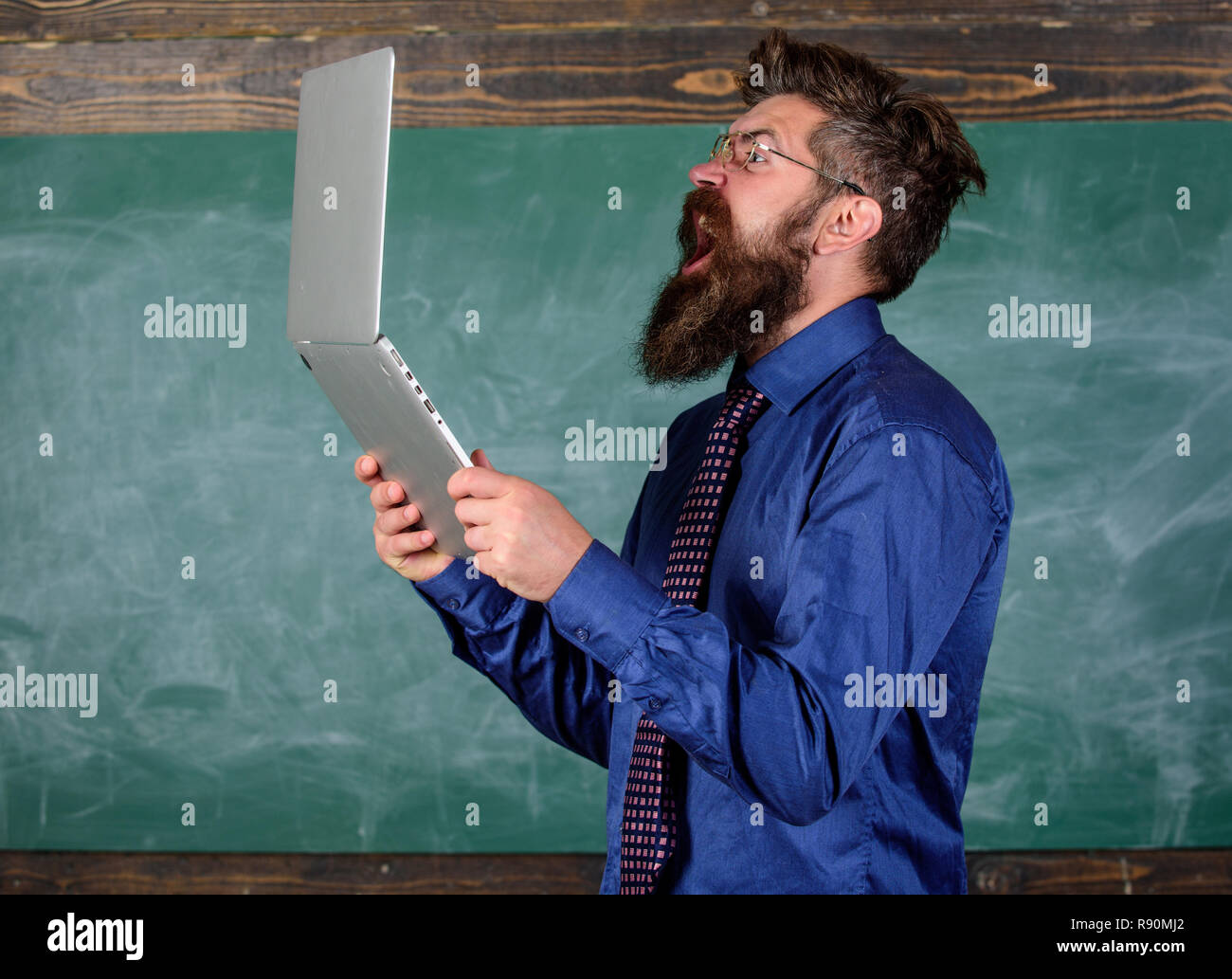 Annoyed by slow internet. Slowly internet annoying him. Hipster teacher ...