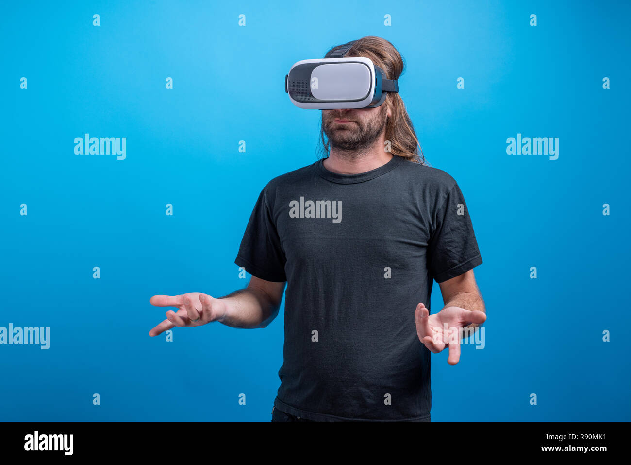 Male potrait wearing VR device looking confused. Virtual device ...