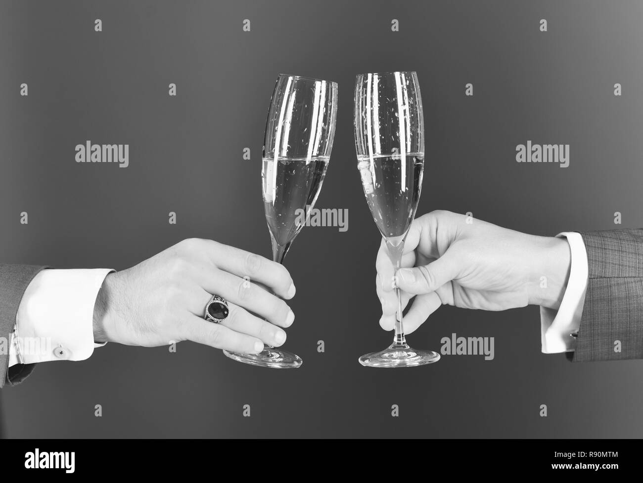 Close up hands toasting wine glass Black and White Stock Photos ...