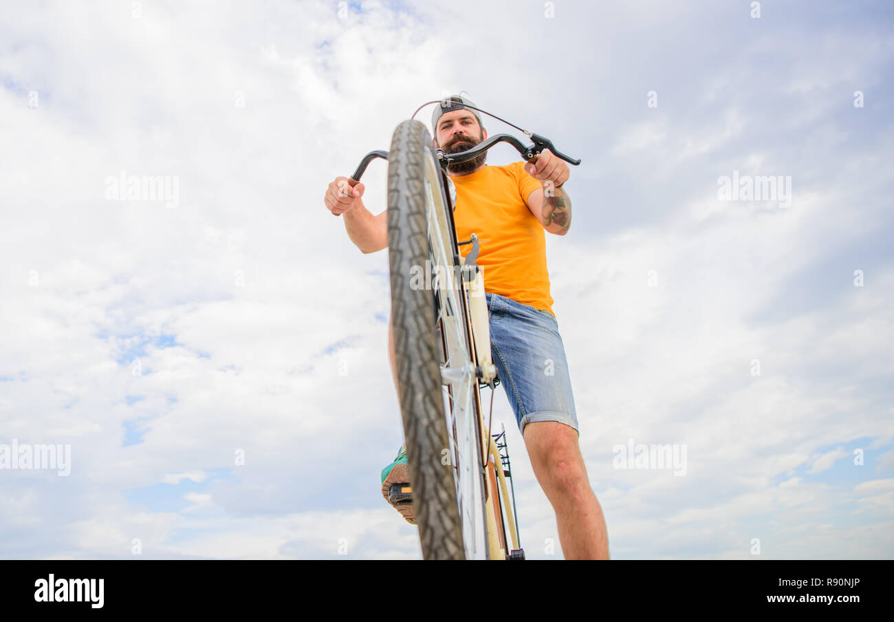 Optimise cycling performance. Man bearded hipster rides bicycle bottom ...