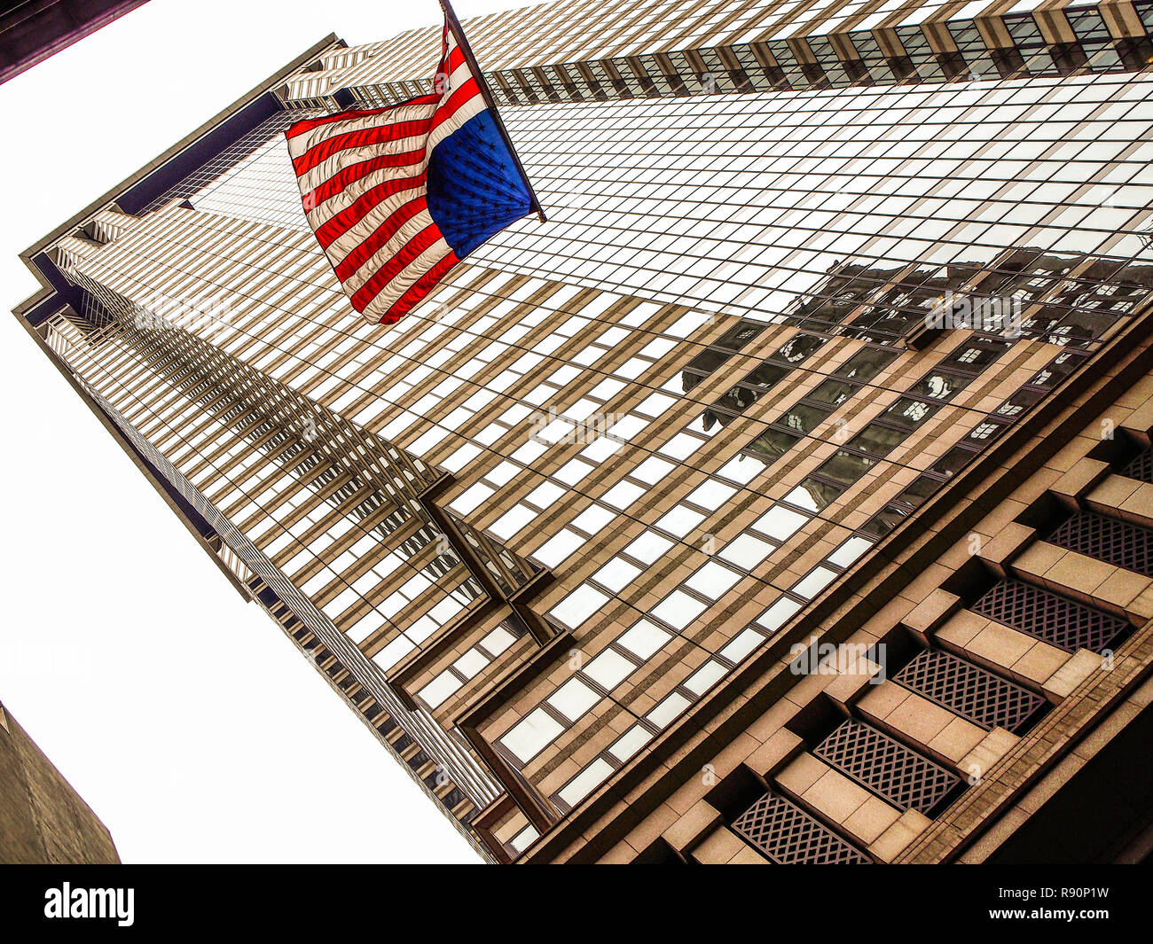Building of New York with American flag Stock Photo - Alamy