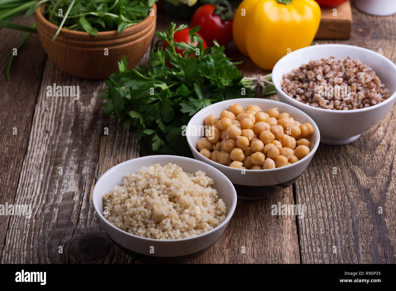 Selection of fresh vegetables and cooked cereal, grains and legume ...