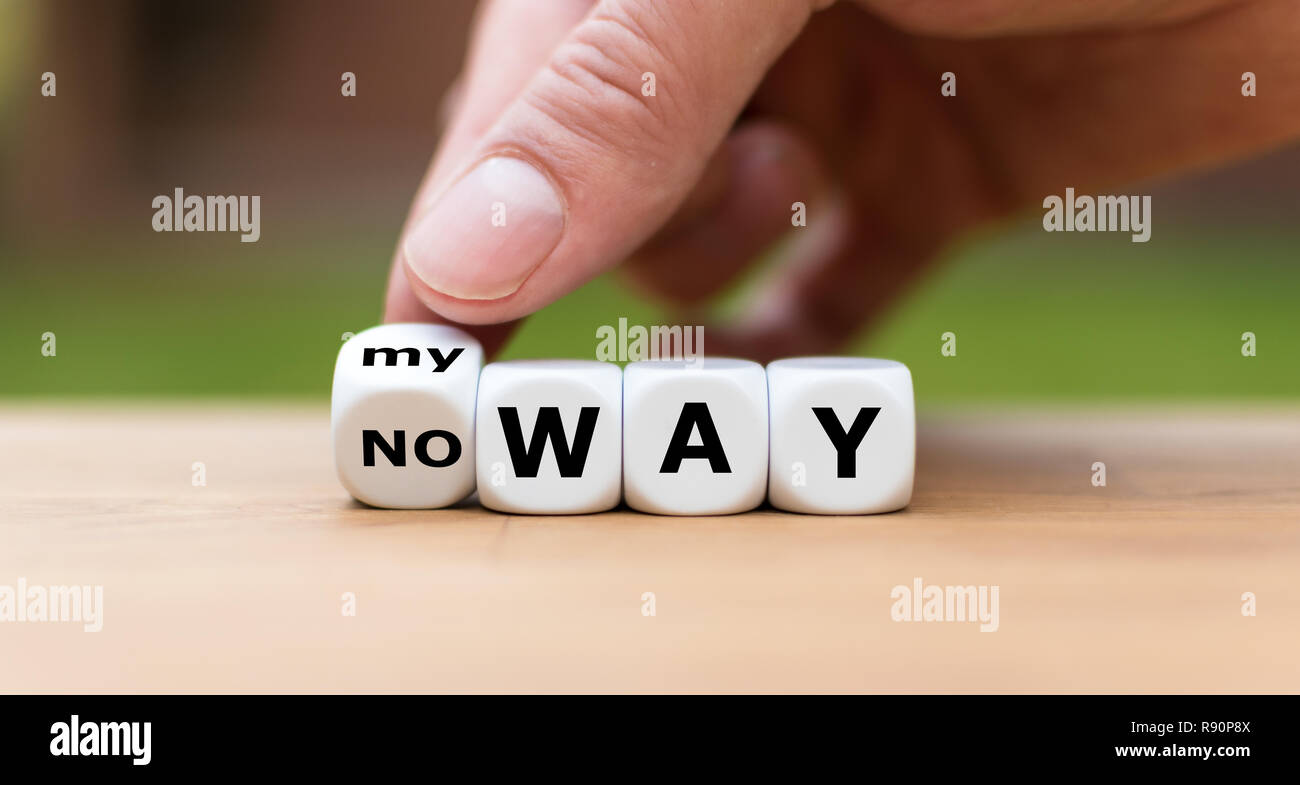 Hand is turning a dice and changes the expression "no way" to "my way ...