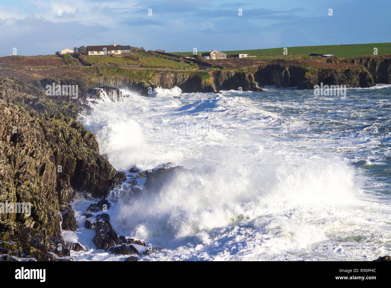 storm waves breaking against a cliff, west cork, ireland Stock Photo ...
