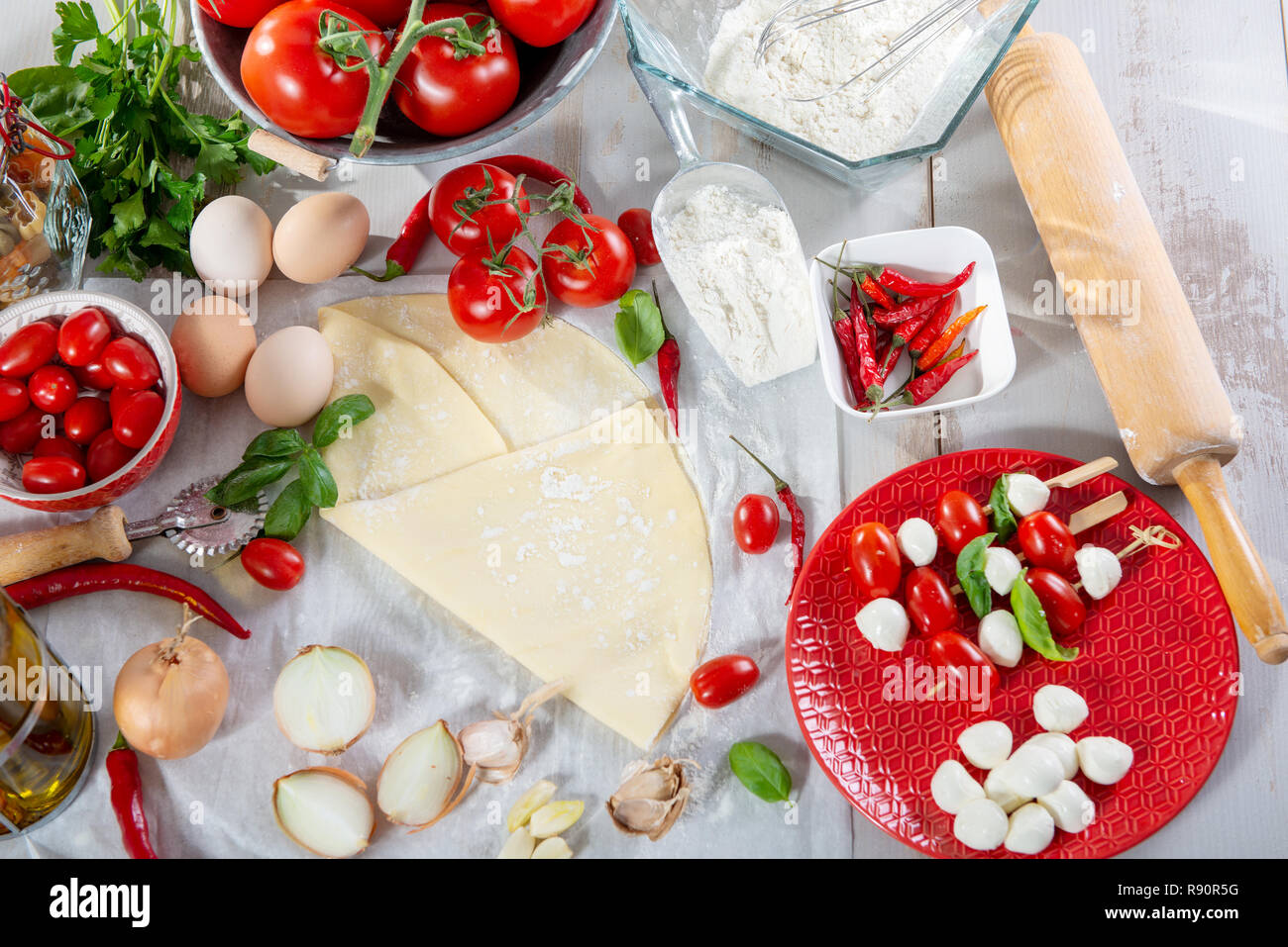 ingredients for the preparation of the delicious pizza Stock Photo - Alamy