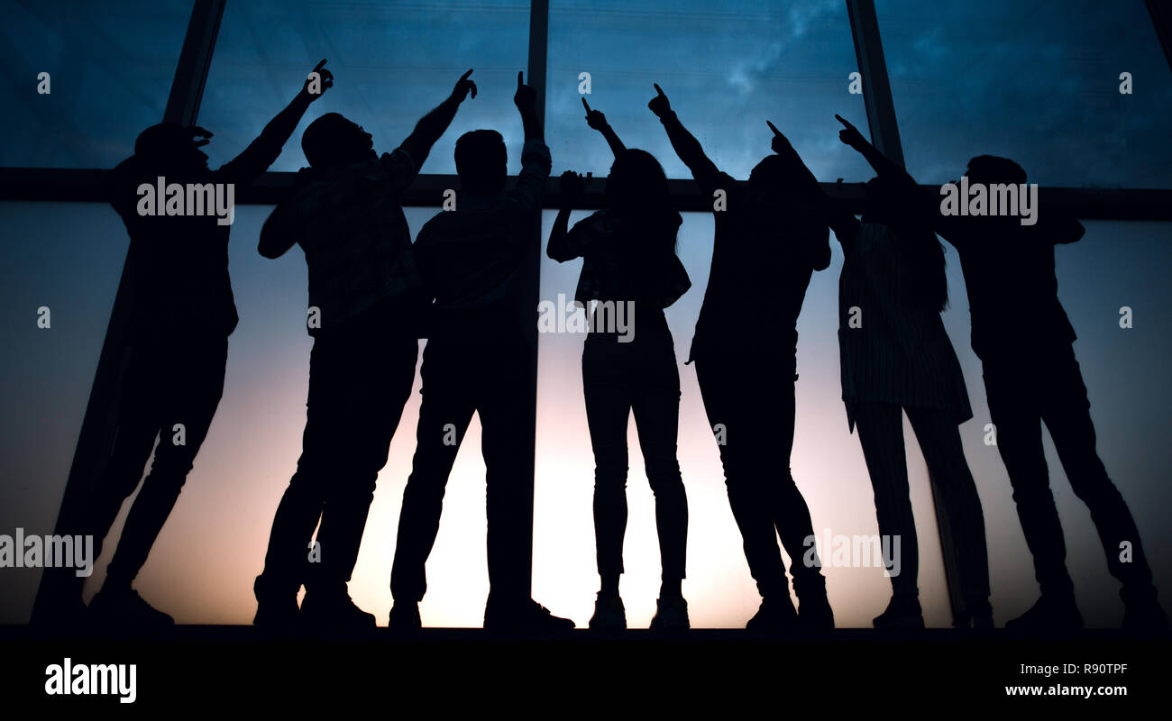 in full growth. business team pointing up Stock Photo - Alamy