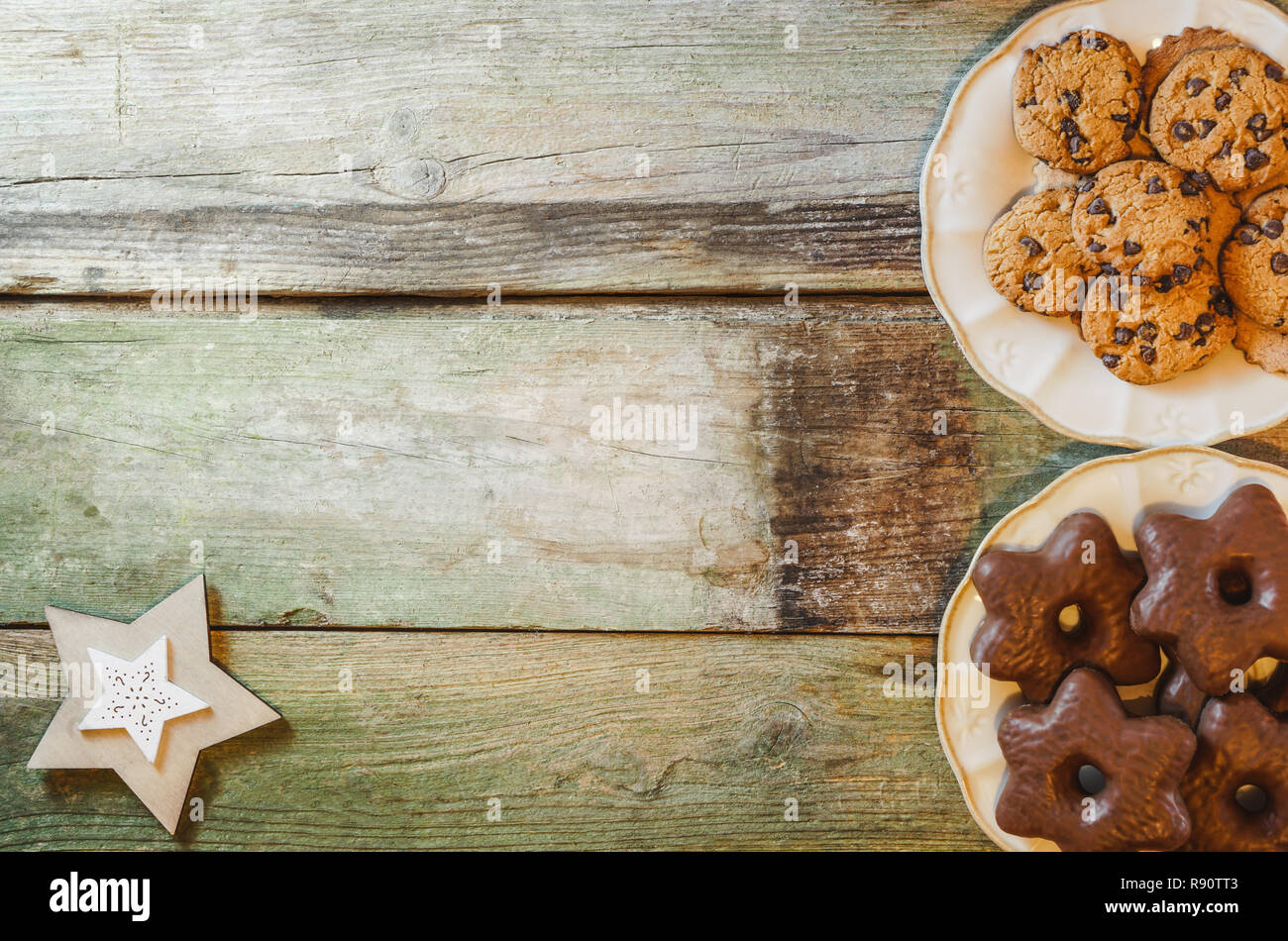 Flat lay of rustic wooden table with chocolate chip and star-shaped ...