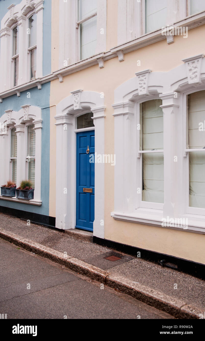 Row of terraced houses on a street in Fowey, Cornwall, England, UK ...