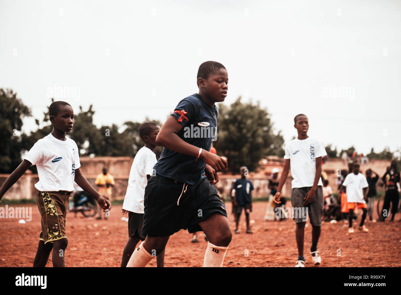 Mali, Africa - Black african children, boys and adults playing soccer ...