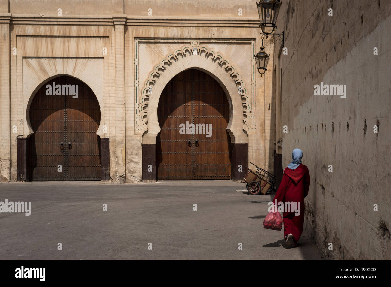 Woman walking towards bab mechouar hi-res stock photography and images ...