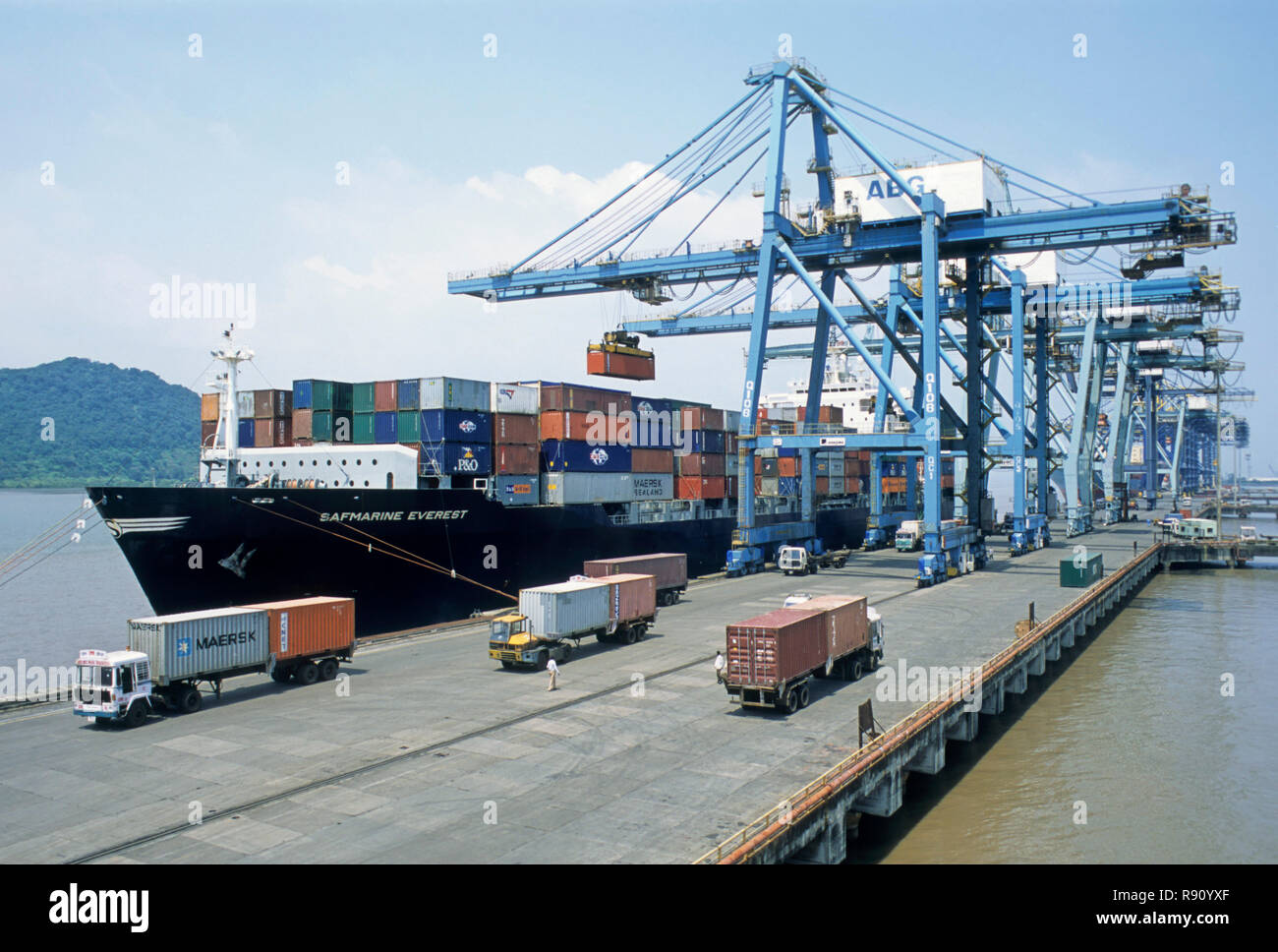 Shipping, containers loading at port, Nhava seva, india Stock Photo - Alamy