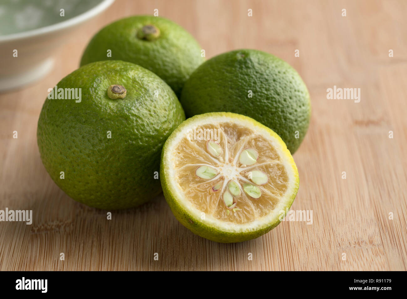 Fresh sour whole and halved kabosu citrus fruit Stock Photo - Alamy