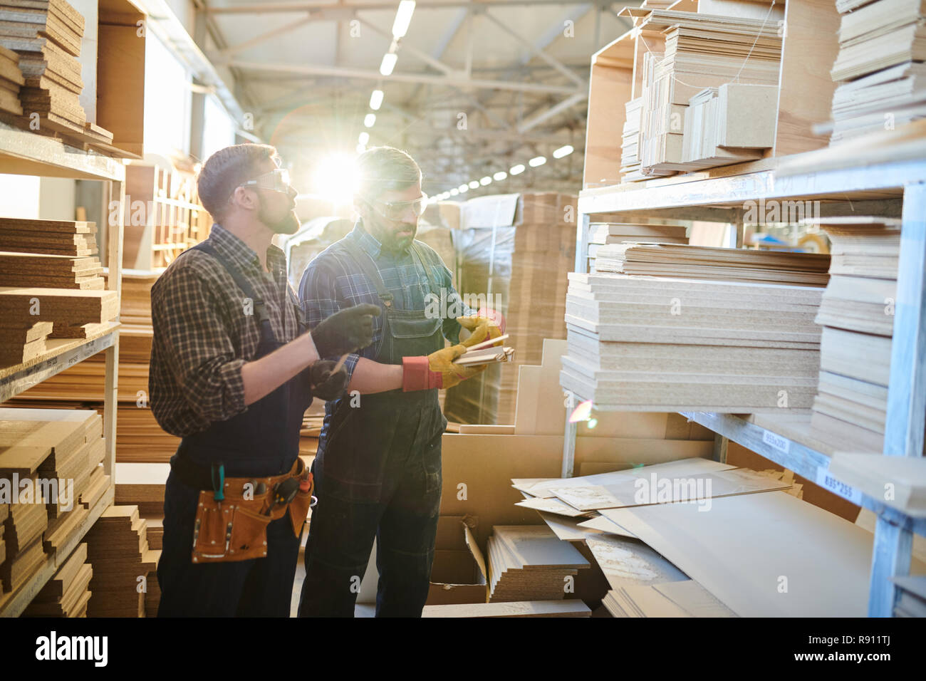 Busy warehouse workers holding inventory audit Stock Photo - Alamy