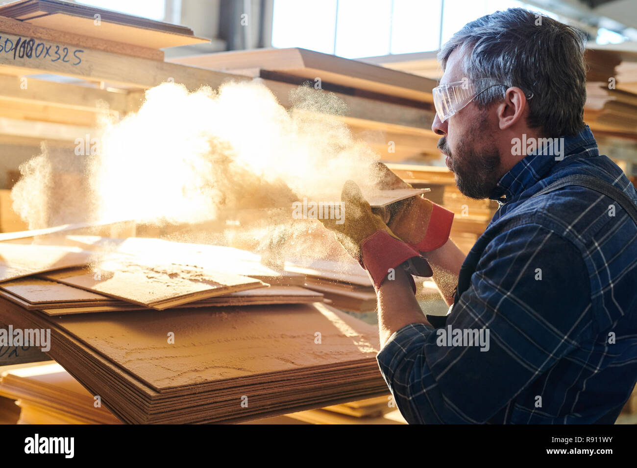 Blowing off sawdust Stock Photo - Alamy