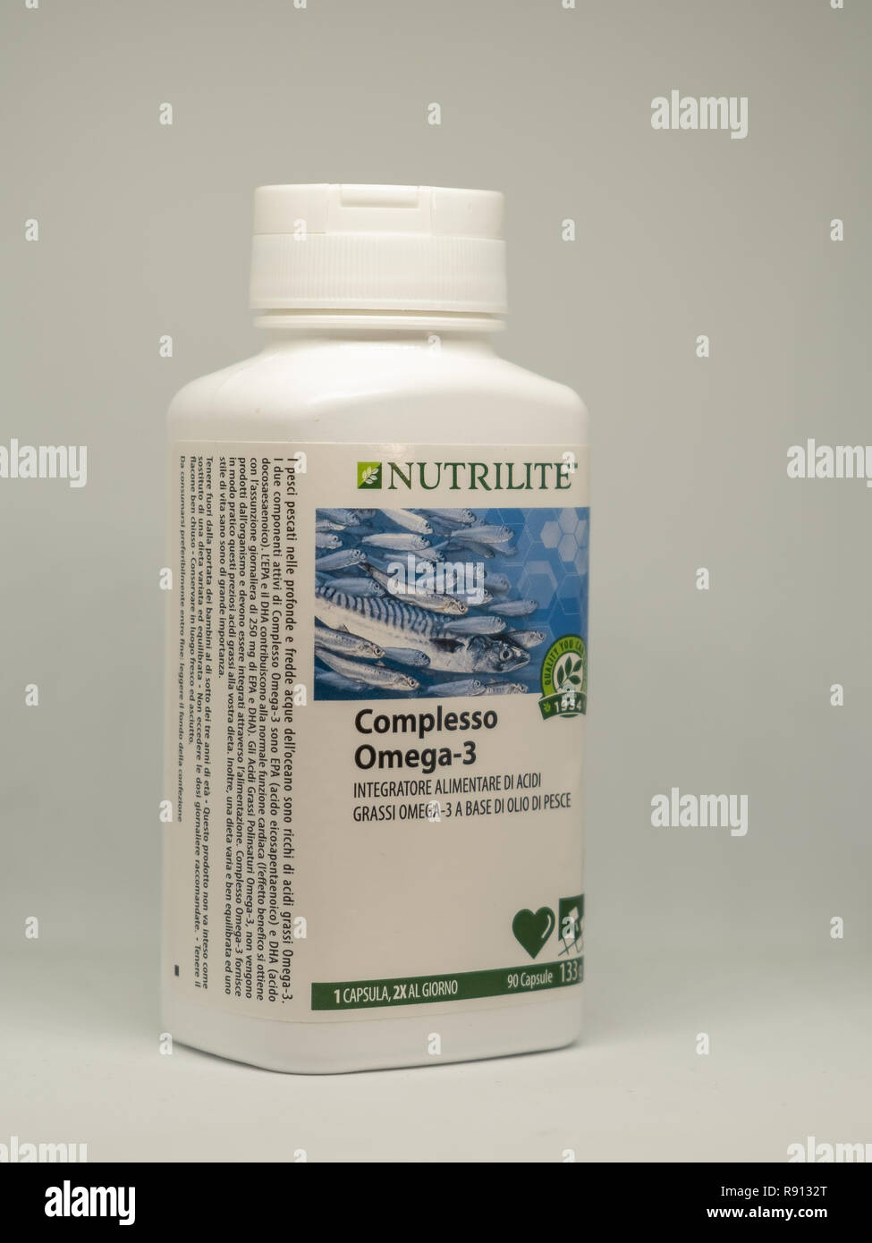 CAGLIARI,ITALY - DECEMBER 2018: Containers and Pile of capsules Omega 3 ...