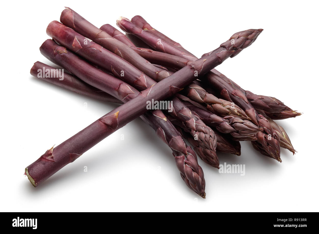 Purple asparagus sticks isolated on white background. Studio shot Stock ...