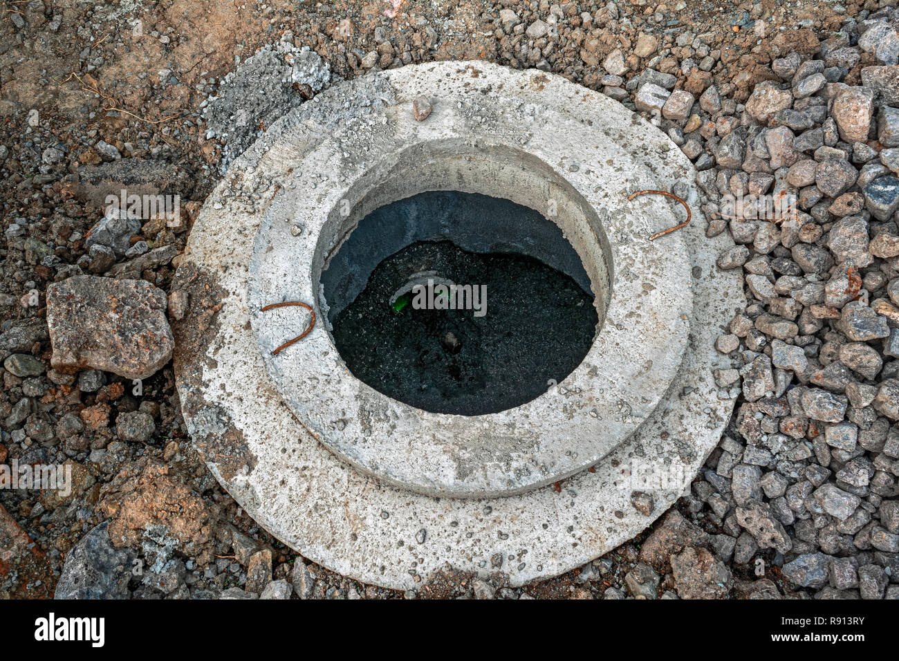 Concrete construction tube pipe. Building a road sewer drain system ...