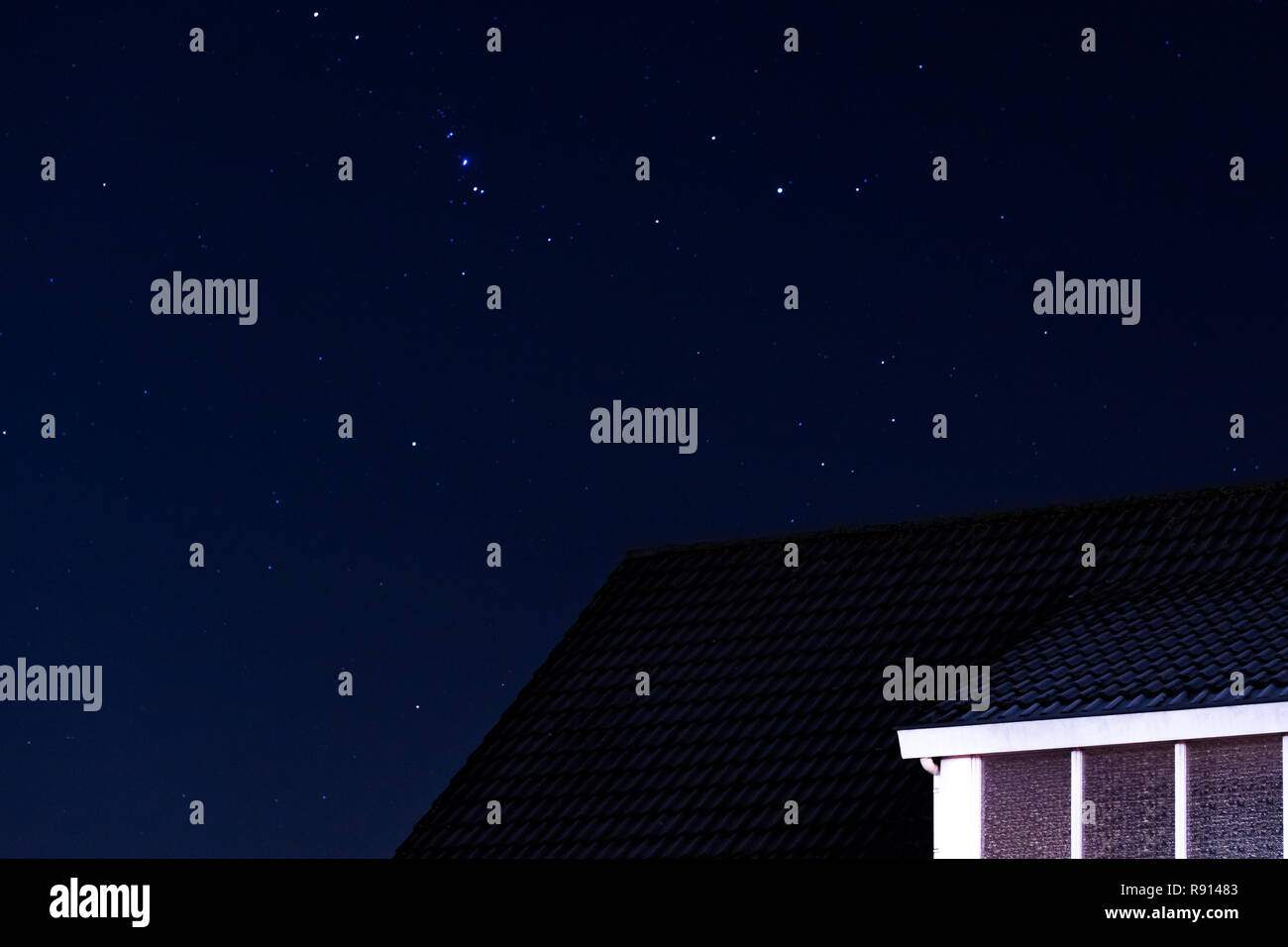 pointy house rooftop with a sky full of stars at night Stock Photo - Alamy