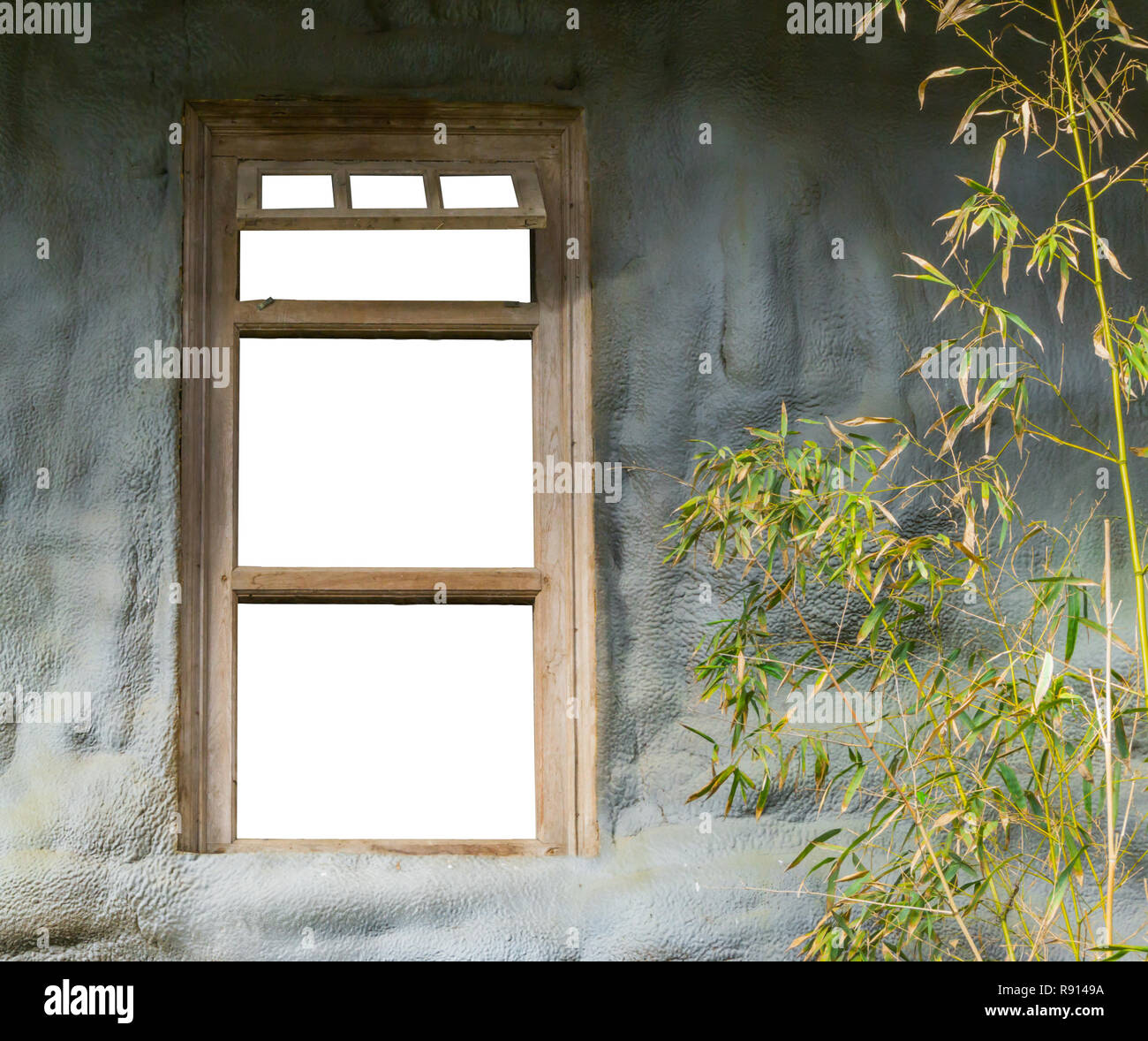 old wooden framework in a stone wall isolated on white, empty space to ...