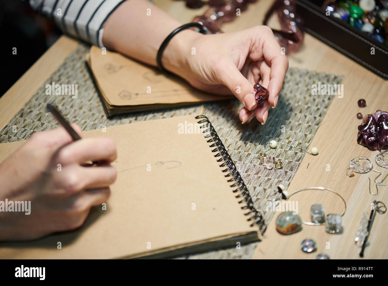 Female jewelry artist with sketch hi-res stock photography and images ...