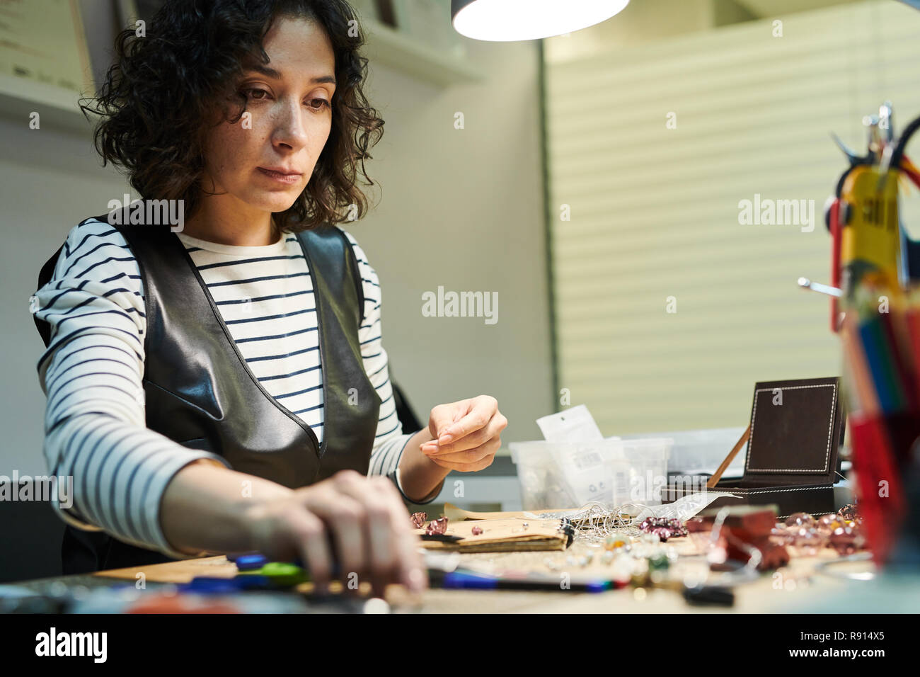 Woman making jewelry craft hi-res stock photography and images - Alamy