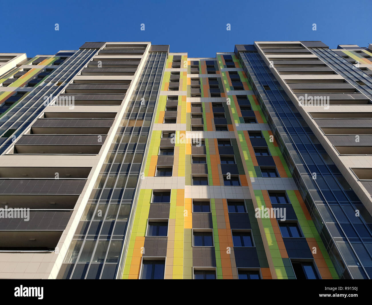 Modern residential building with the tiled facade Stock Photo - Alamy