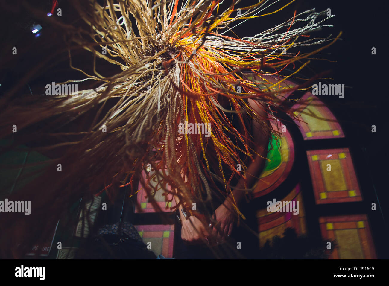 attractive young woman dancing, hair flying orange Stock Photo - Alamy