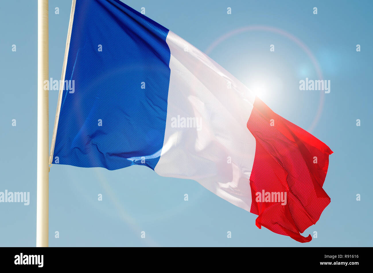 french flag with blue sky and sun Stock Photo - Alamy