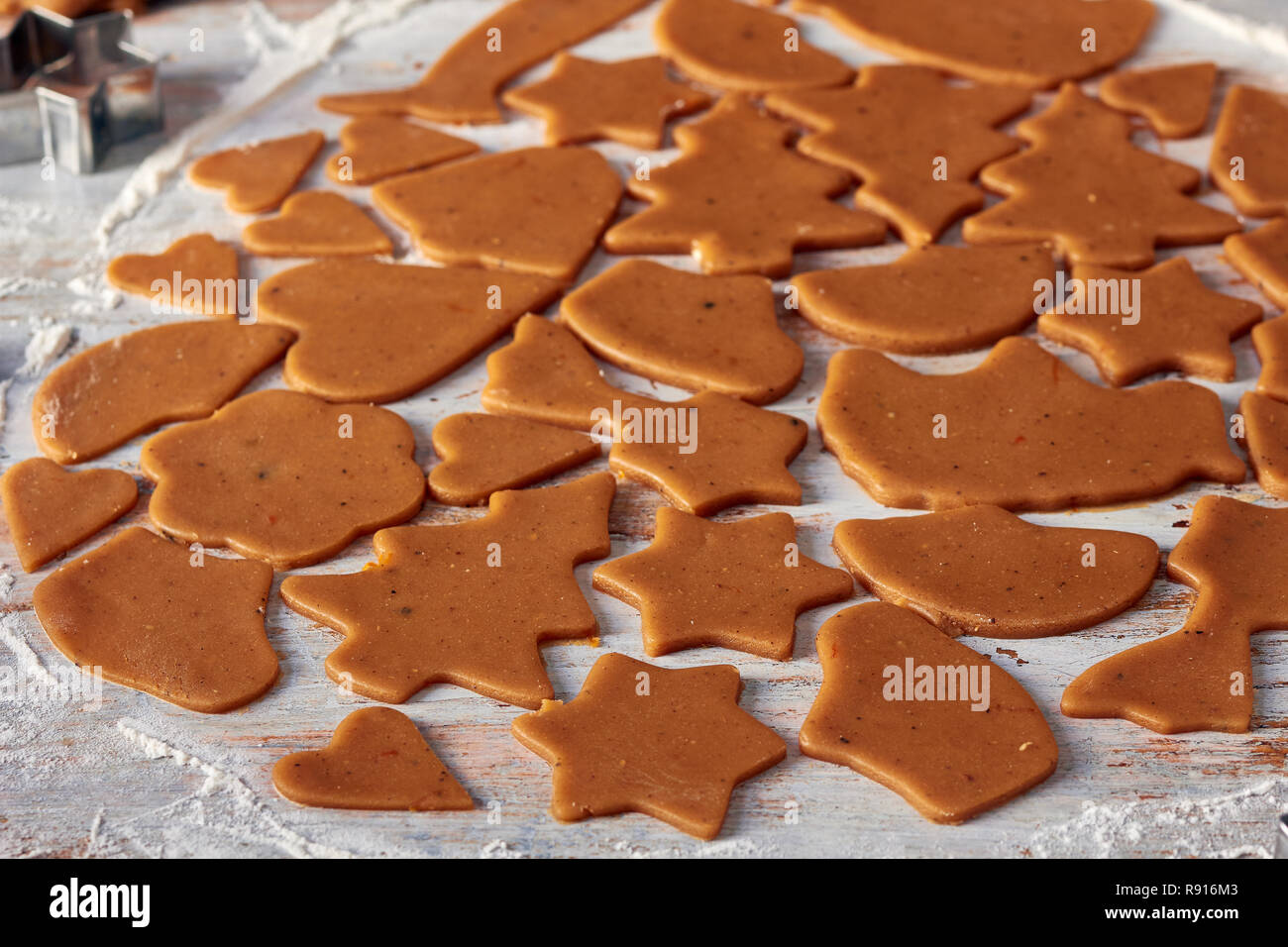 Carved out cookies shapes from gingerbread dough Stock Photo - Alamy