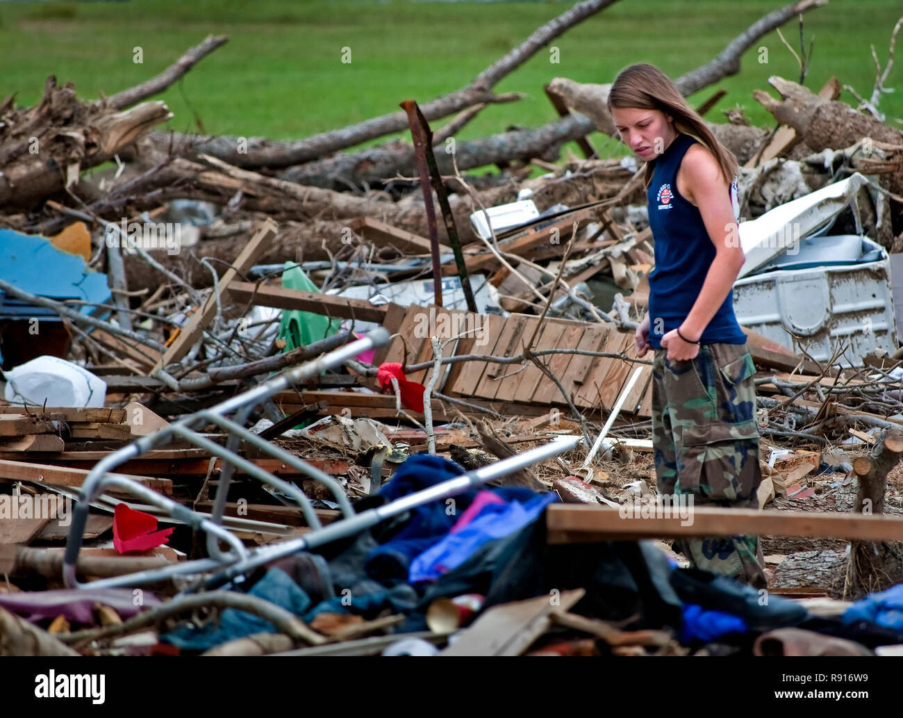 A girl sifts through the rubble of a demolished home, May 15, 2011 ...