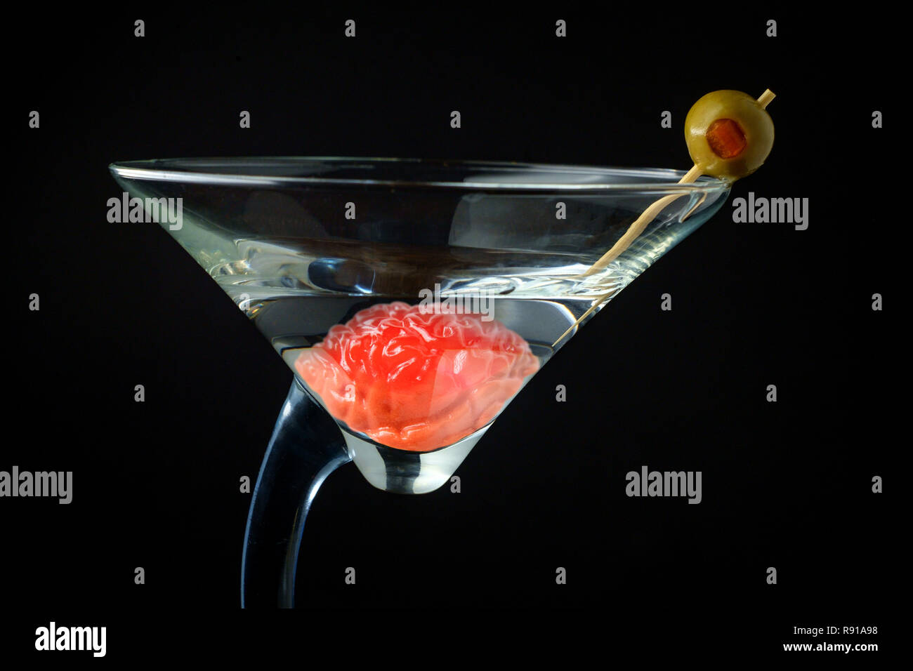 Human brain in martini glass soaking in liquor for alcoholism addiction ...