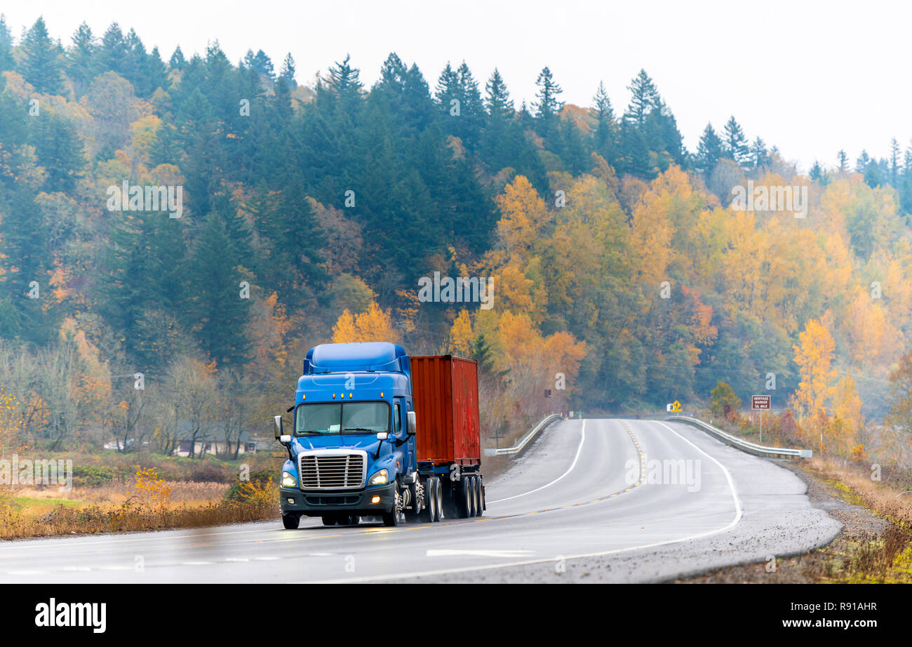 Blue big rig day cab for local haul semi truck with flat bed semi ...