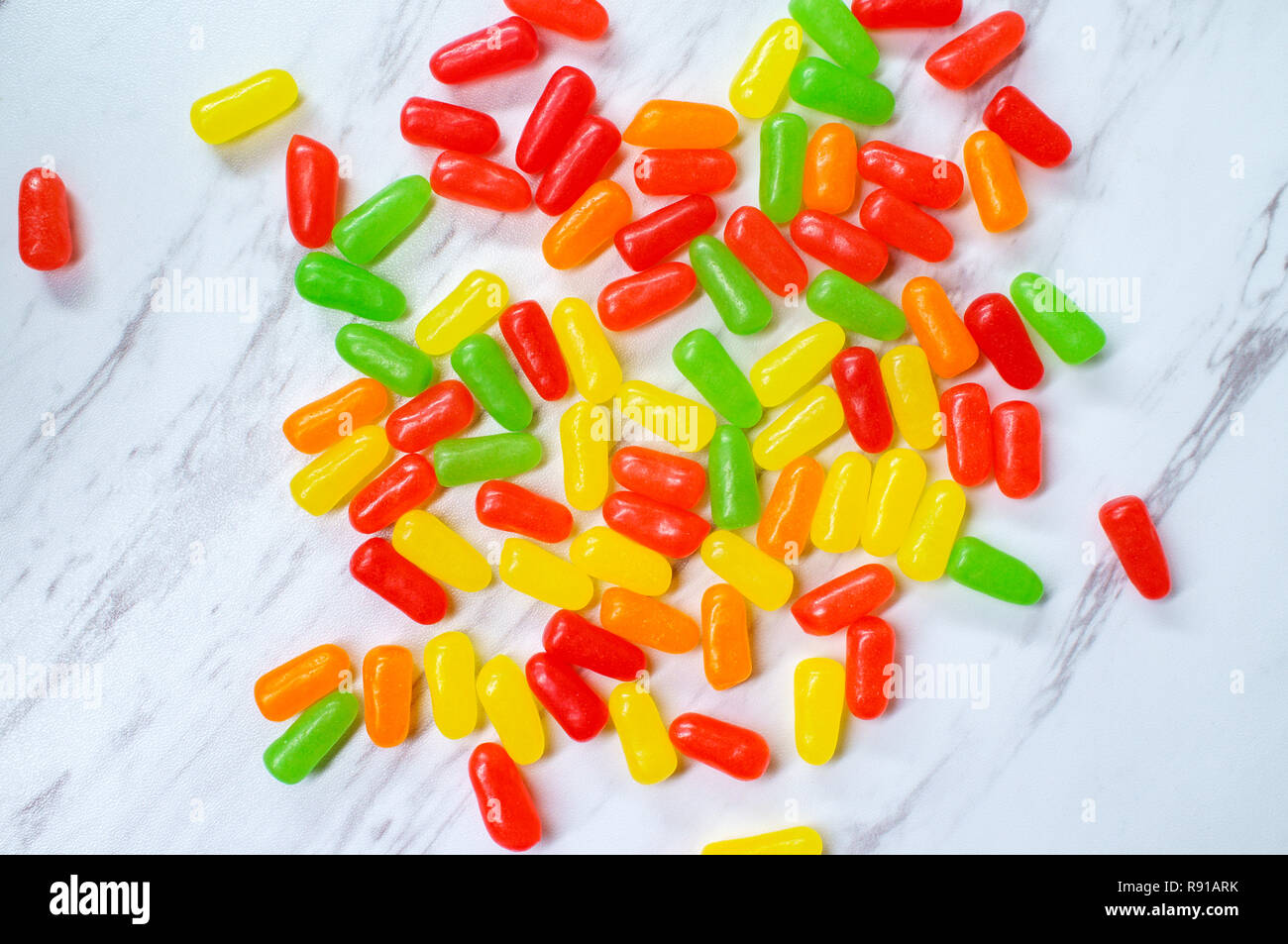 Fruit flavored colorful candy jelly bean gummies Stock Photo - Alamy