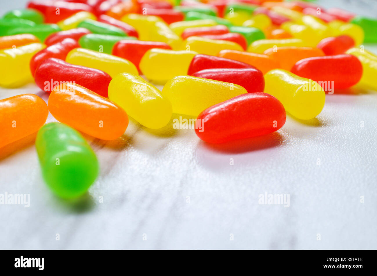Fruit flavored colorful candy jelly bean gummies Stock Photo - Alamy