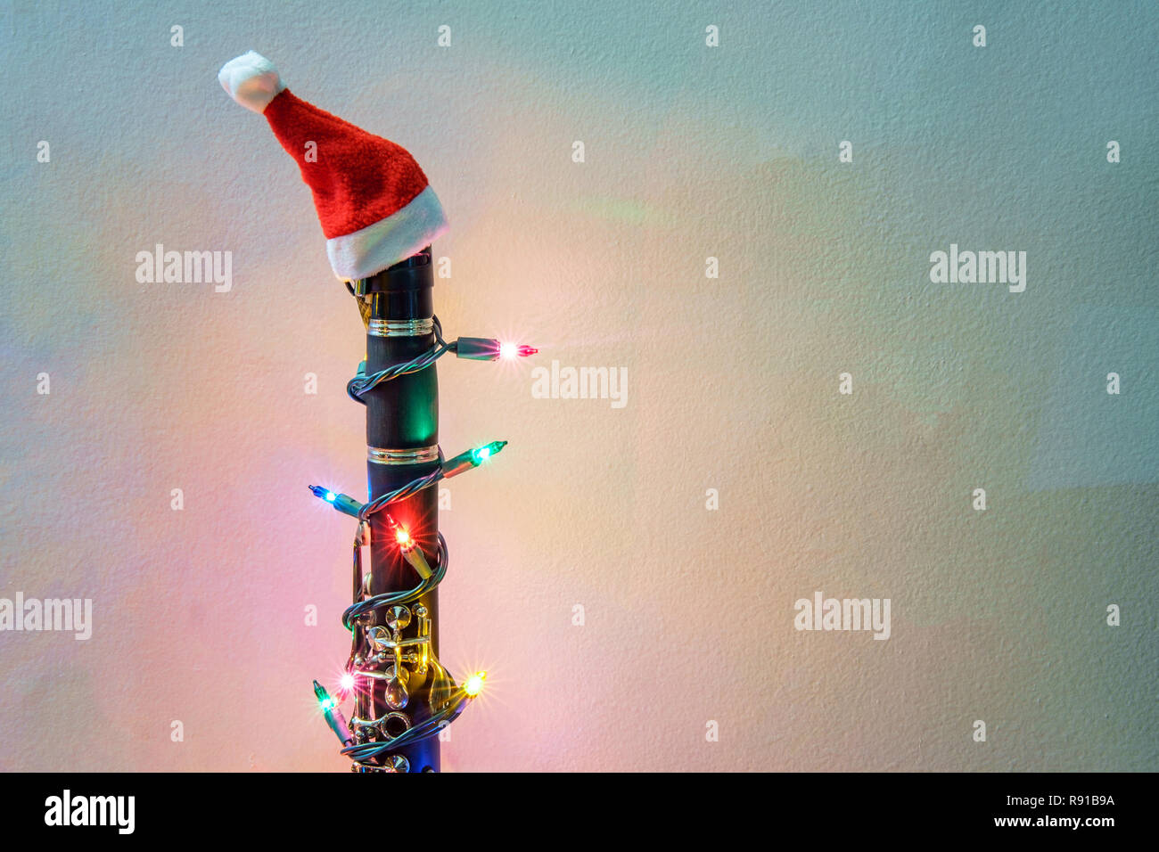 Seasonal holiday musical instrument clarinet with Christmas santa hat ...