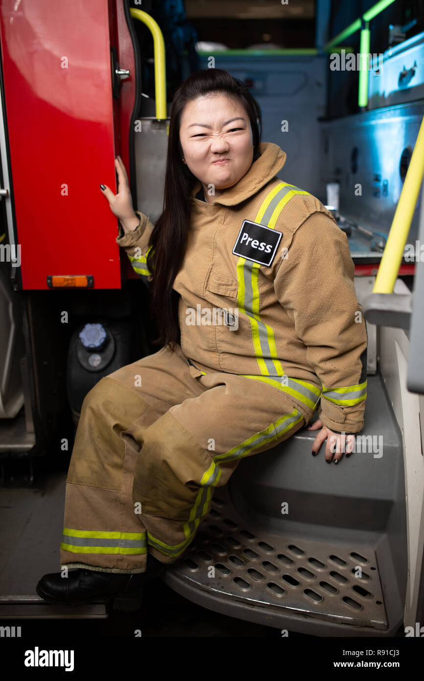 Picture of woman firefighter on background of fire truck Stock Photo ...