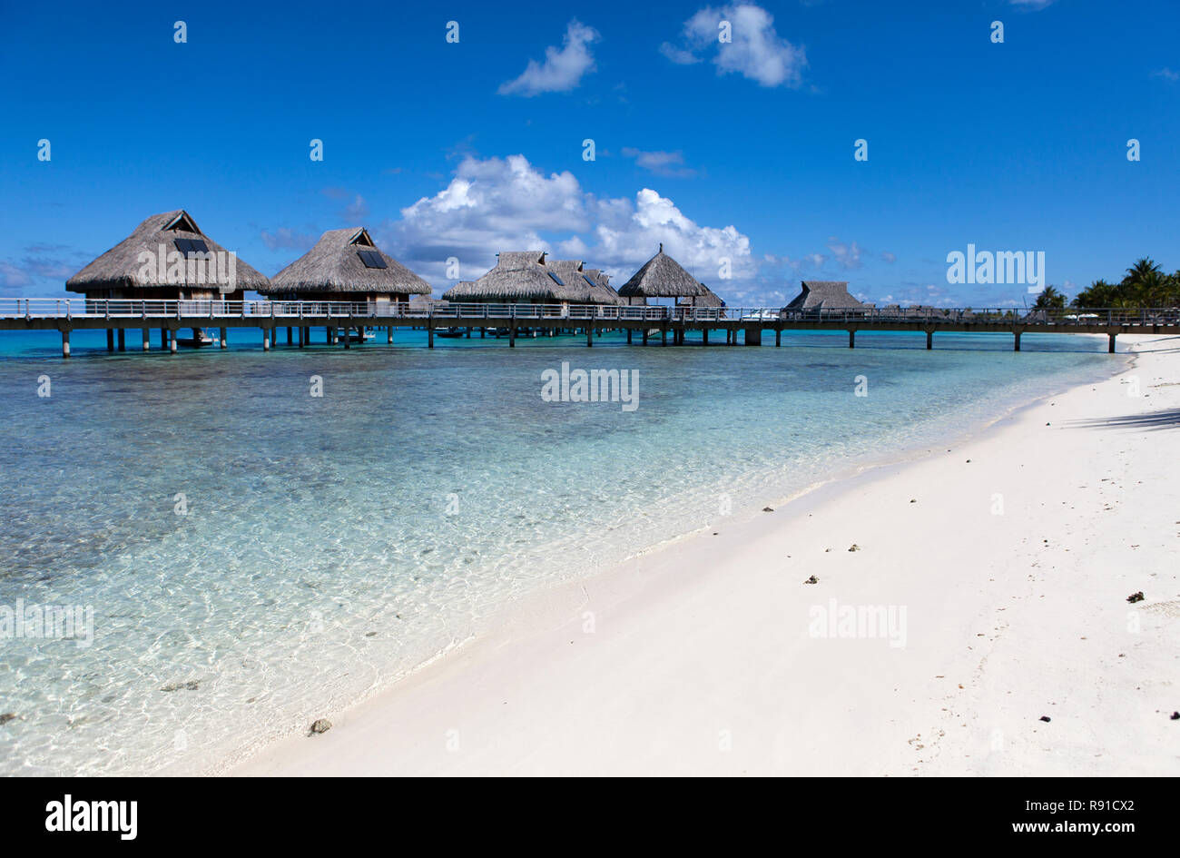 Typical Polynesian landscape -small houses on water Stock Photo - Alamy