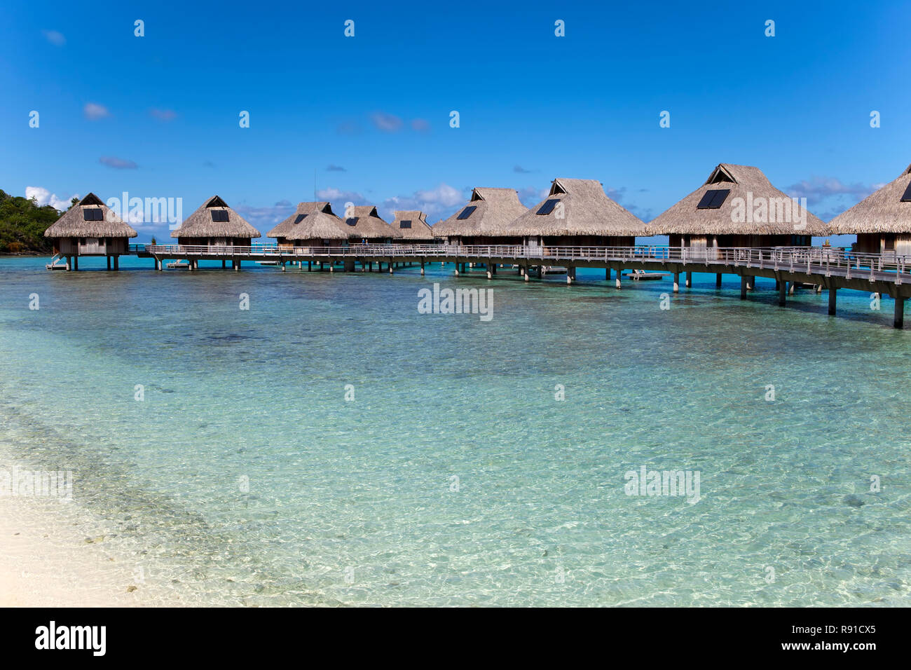 Typical Polynesian landscape -small houses on water Stock Photo - Alamy