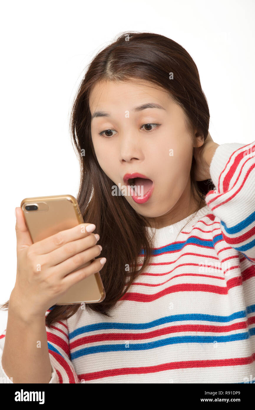 Beautiful Asian woman using a smart phone to send a text message ...