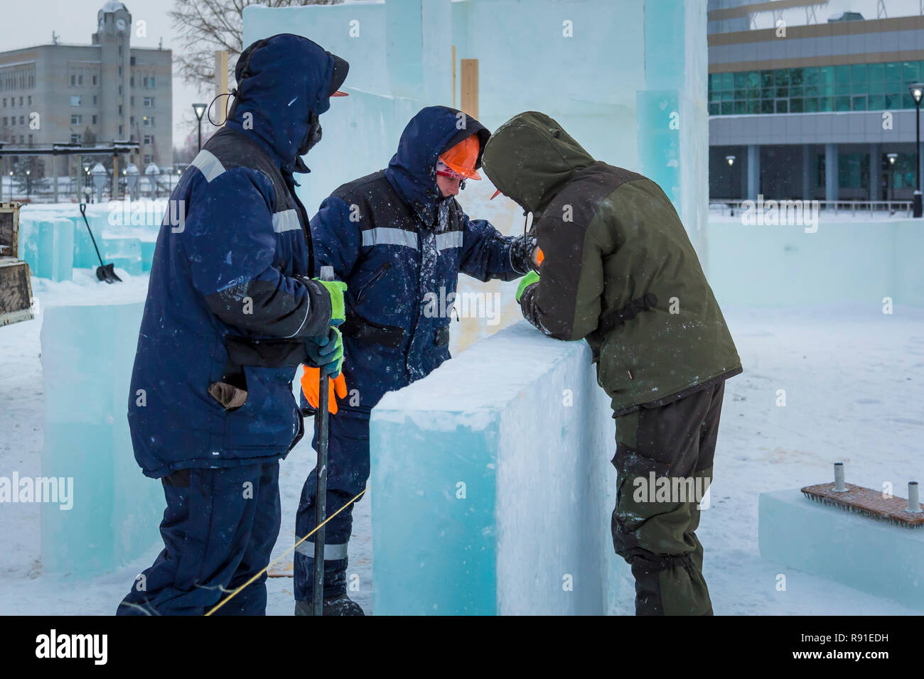 Installers are building an ice town of ice blocks Stock Photo - Alamy