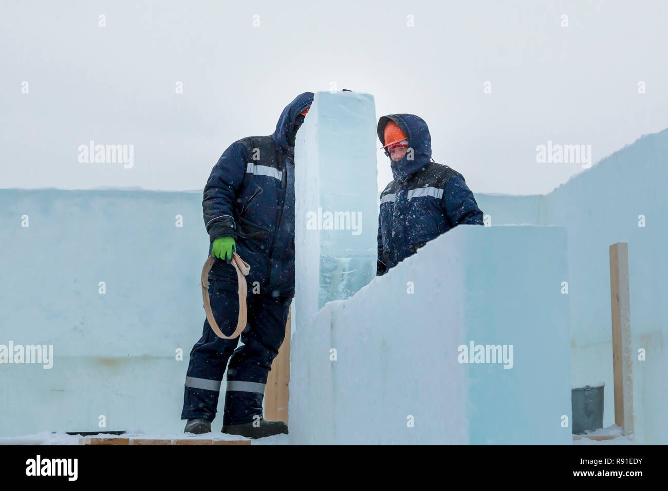 Installers are building an ice town of ice blocks Stock Photo - Alamy