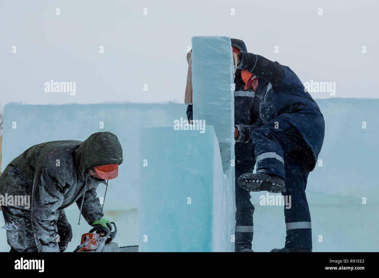 Installers are building an ice town of ice blocks Stock Photo - Alamy