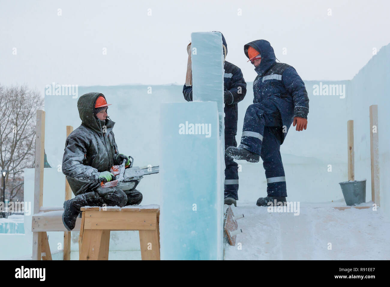 Installers are building an ice town of ice blocks Stock Photo - Alamy